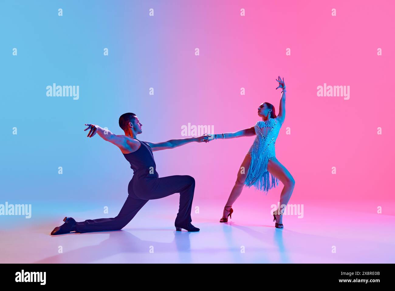 Ballroom dancers in perfect harmony, their fluid movements frozen in ...