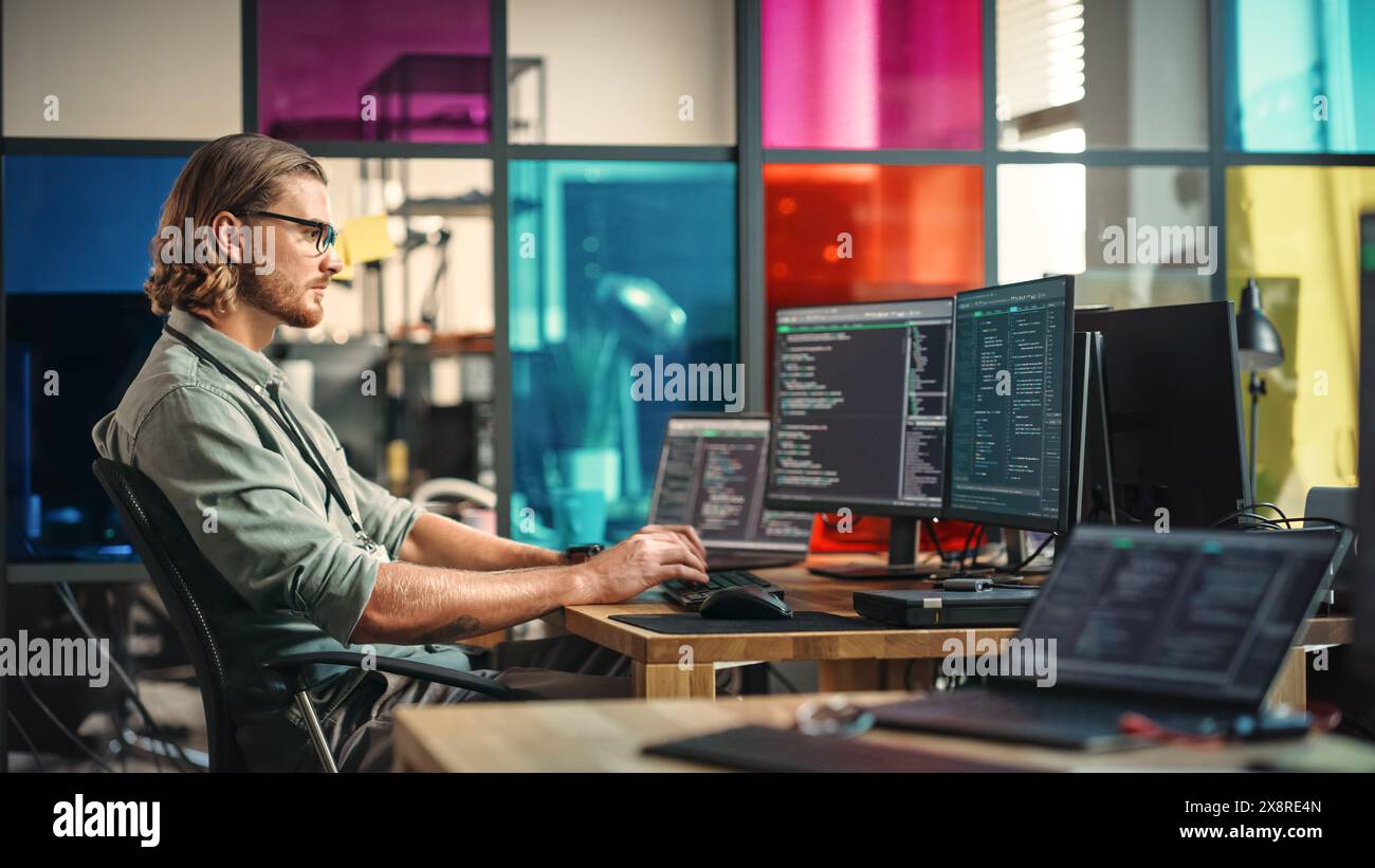 Caucasian Man Writes Code on Desktop Computer With Professional ...