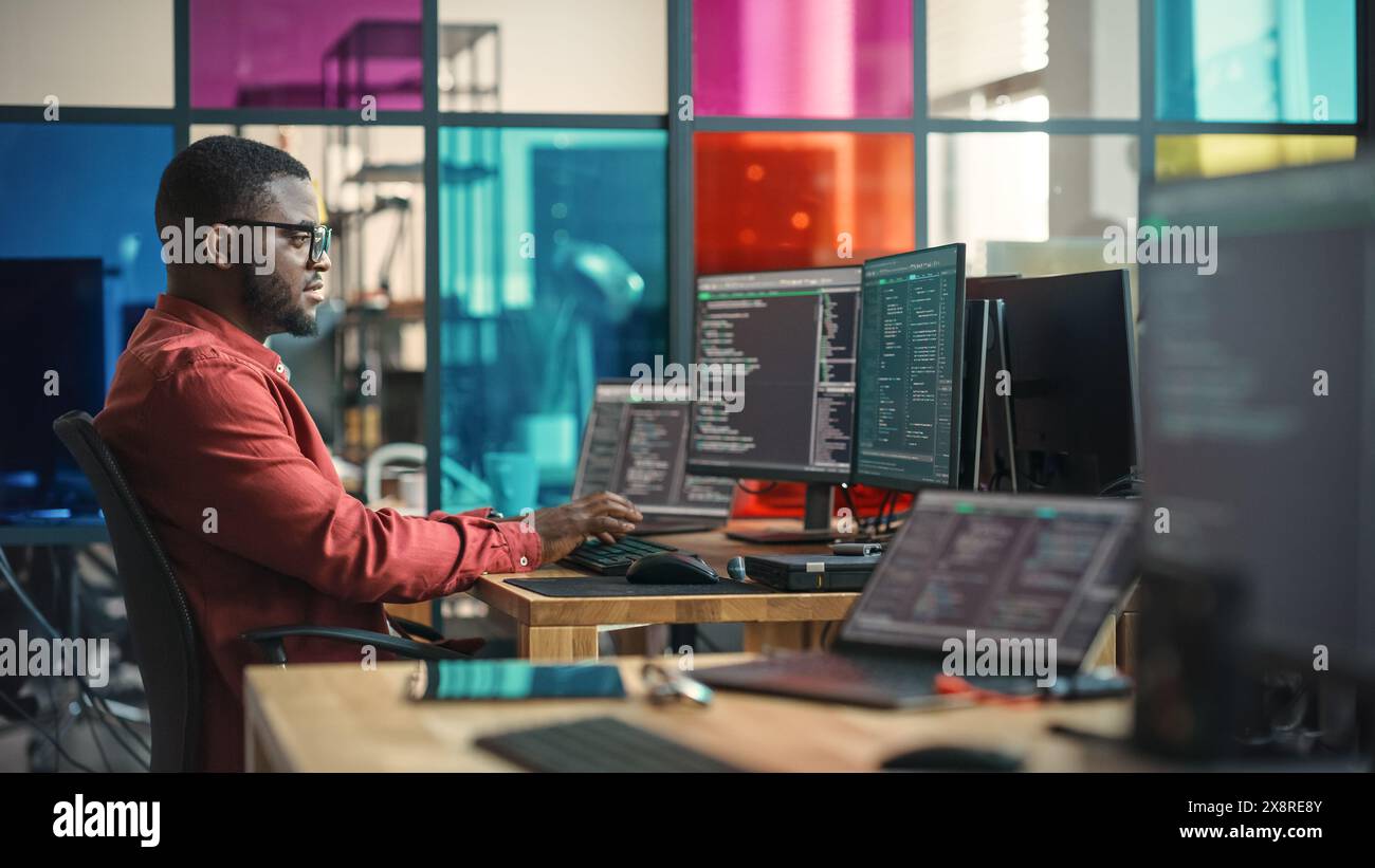 African American Man Writing Lines Of Code On Desktop Computer With ...