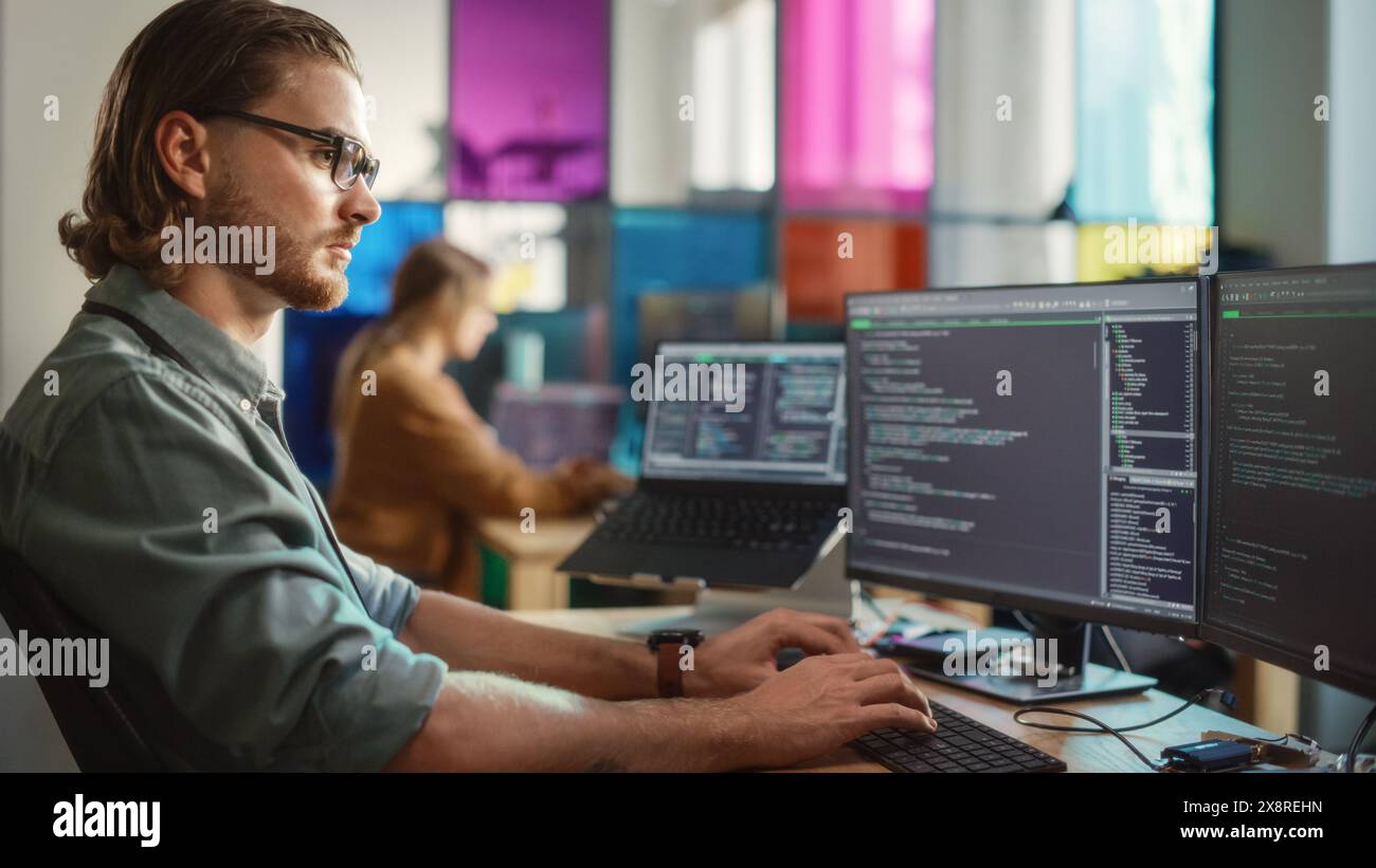 Developer using multiple displays coding hi-res stock photography and images - Alamy