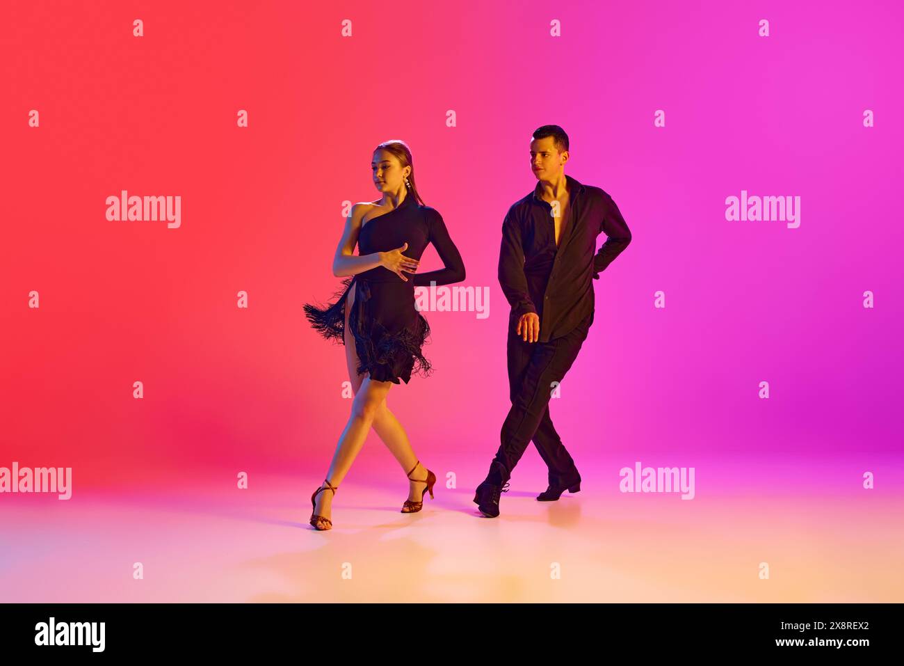 Dynamic portrait of ballroom dance duo captured in vibrant performance ...