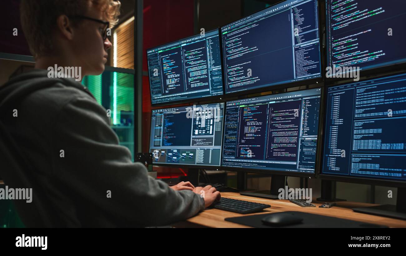 Young Caucasian Man Writing Code on Professional Six Monitors Setup in ...