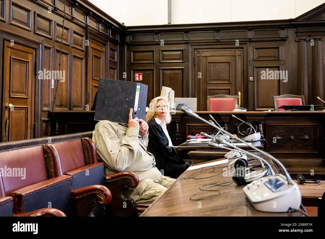 27 May 2024, Hamburg: An accused alleged "Reichsbürger" sits next to ...