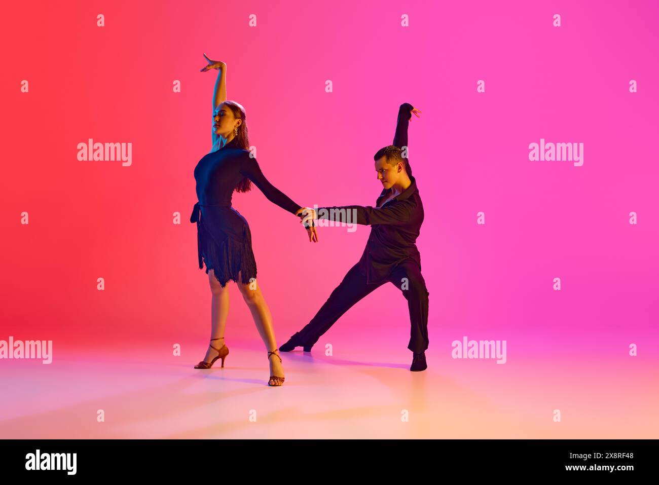 Talented ballroom dancers in perfect harmony, their fluid movements ...