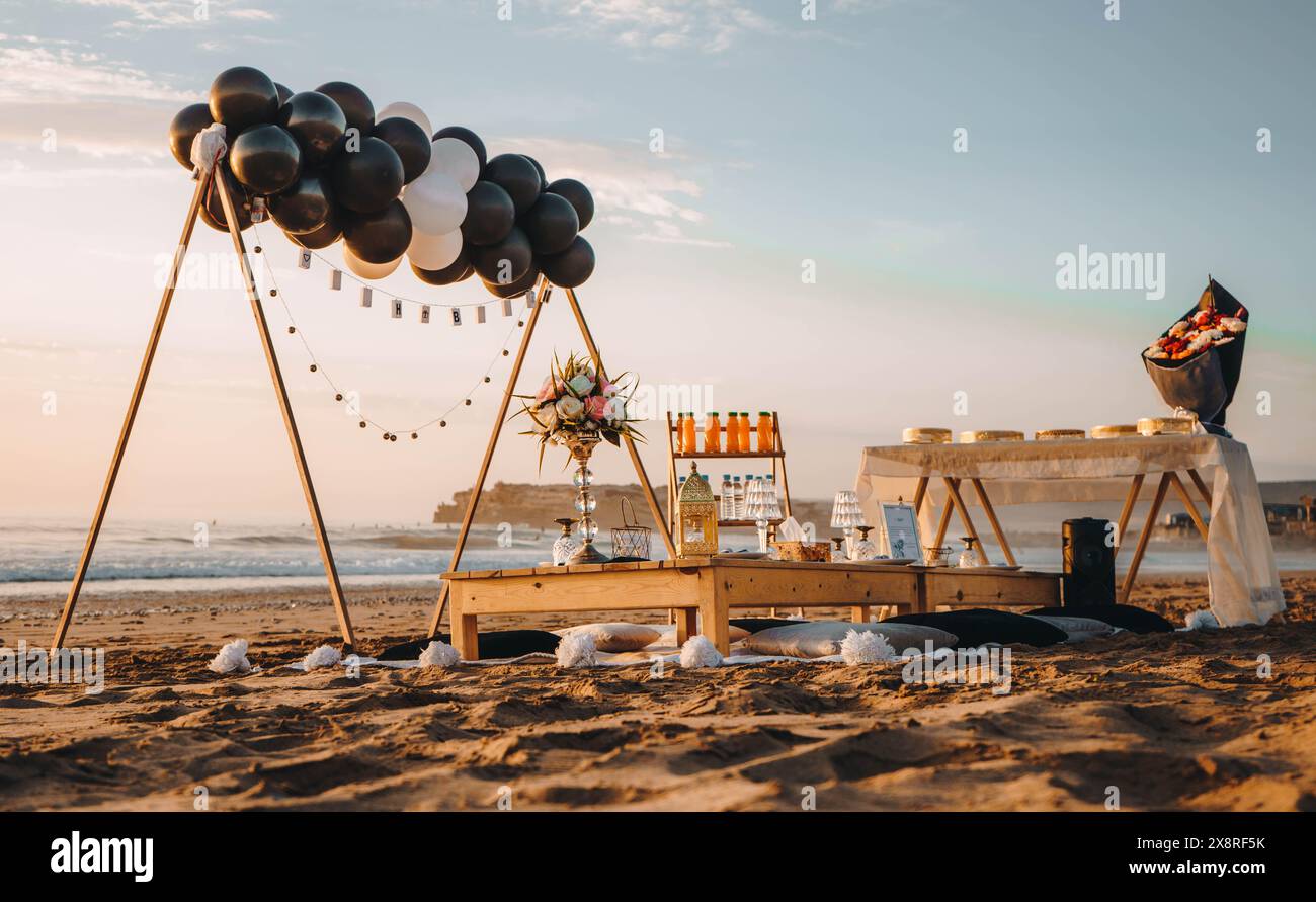 Birthday celebration ceremony on the beach at Tamraght agadir, Morocco Stock Photo - Alamy