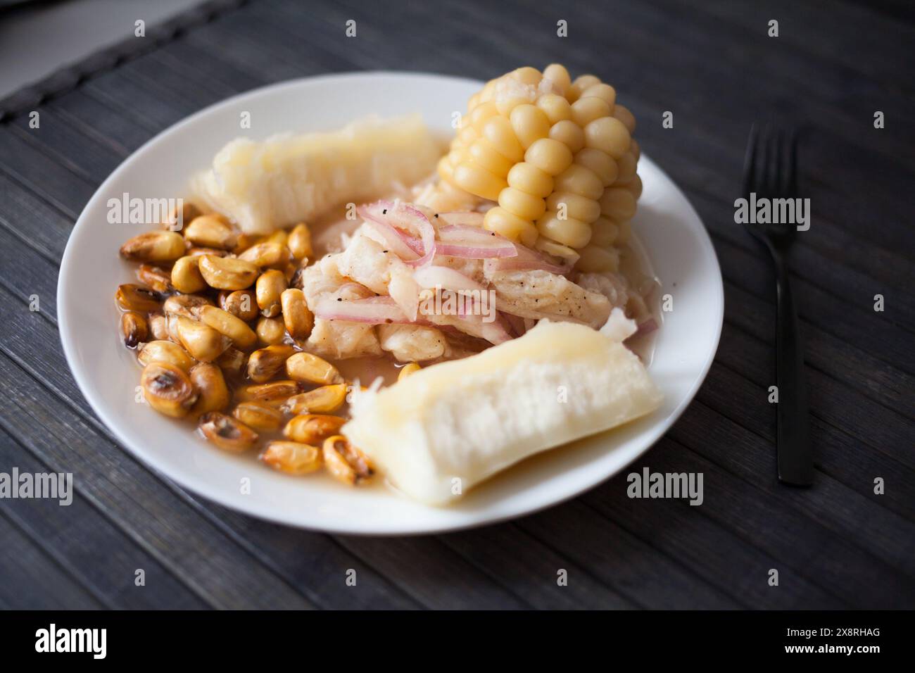 Peruvian traditional dish.fish ceviche with yuka and corn Stock Photo ...