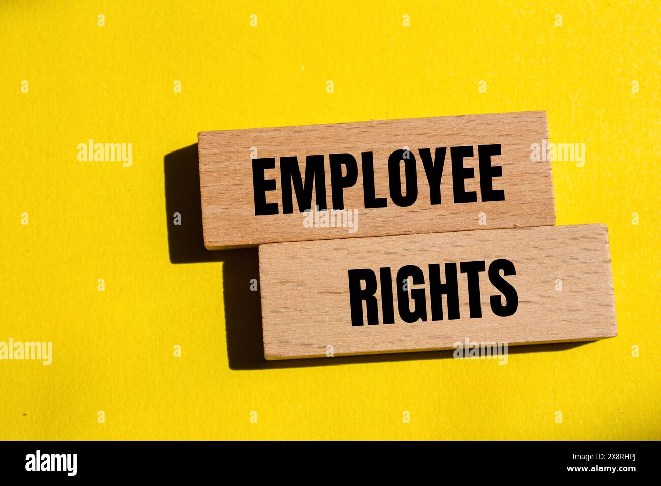 Employee rights words written on wooden blocks with yellow background ...