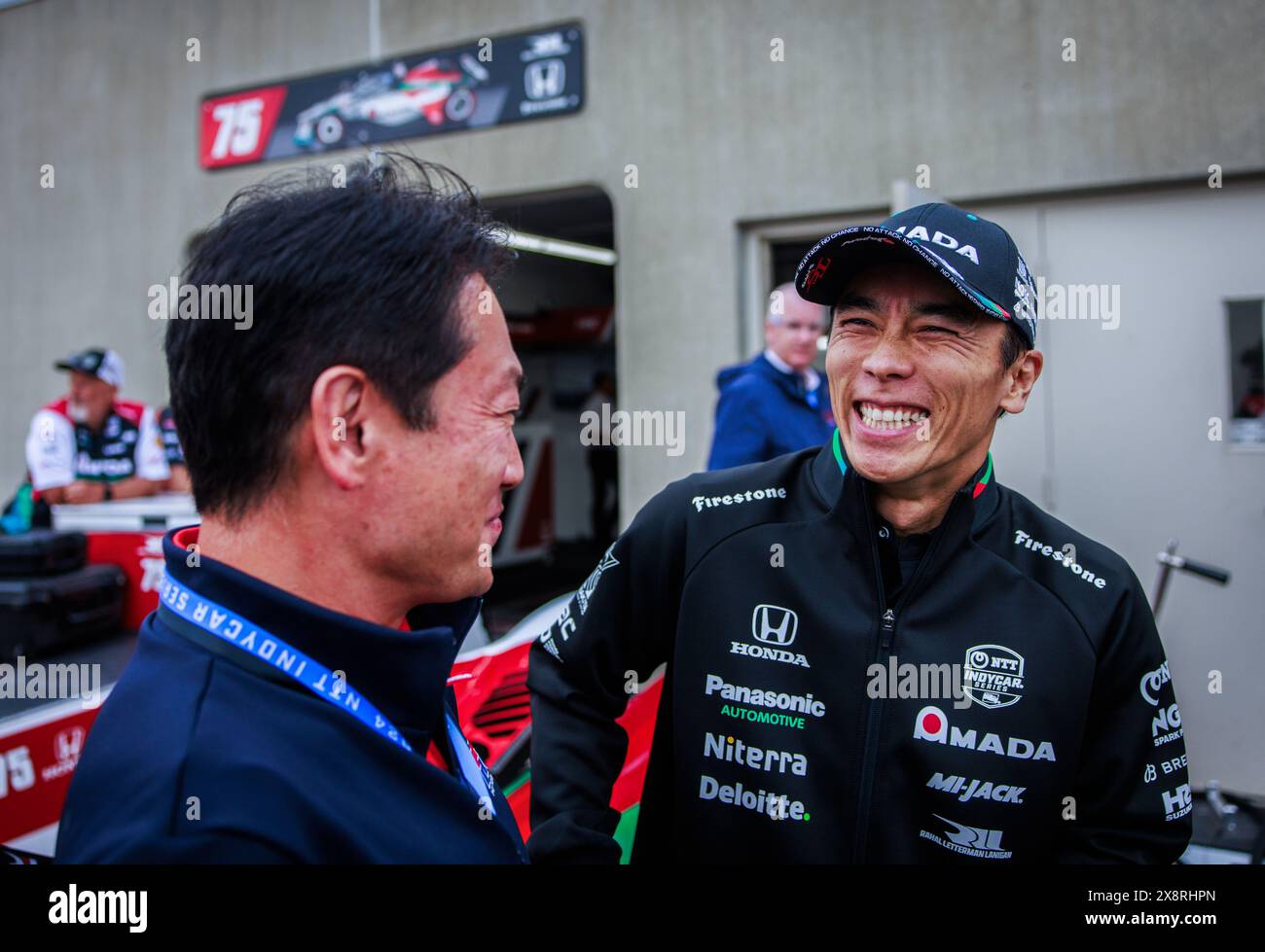 Indianapolis, United States. 26th May, 2024. Takuma Sato, right, talks ...