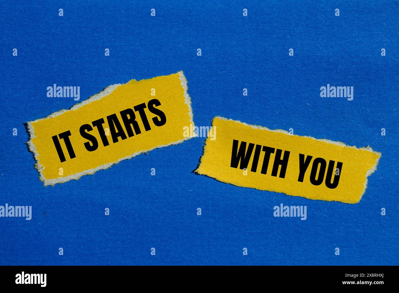 It starts with you words written on ripped yellow paper pieces with ...