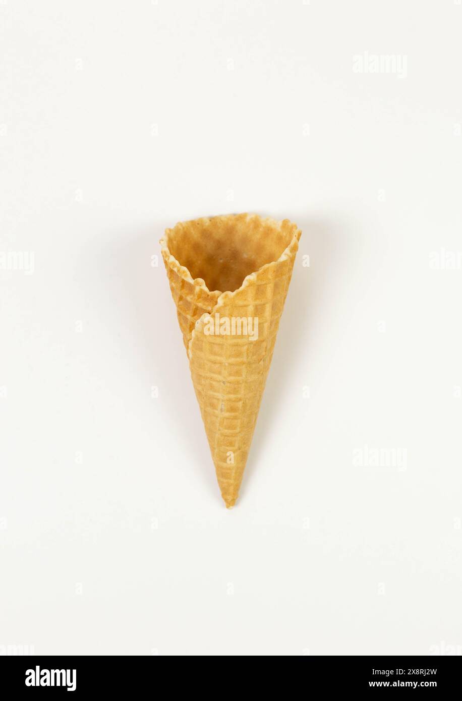 Top view of ice cream waffle cone on white background. Summer wallpaper ...