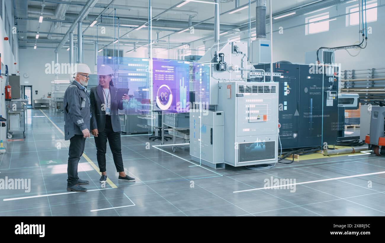 Factory Digitalization: Two Industrial Engineers Use Tablet Computer ...