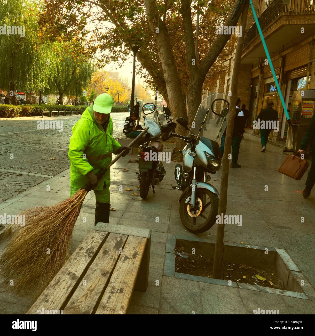 Tehran, Iran- December 19, 2022: The work of a street sweeper in ...