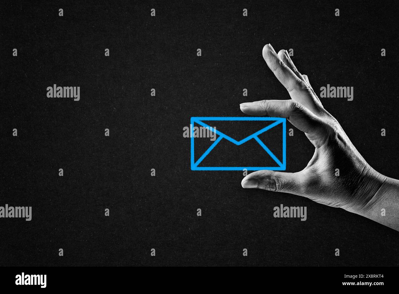 Hand in Black and White Holding Email Sign on Textured Paper Background ...