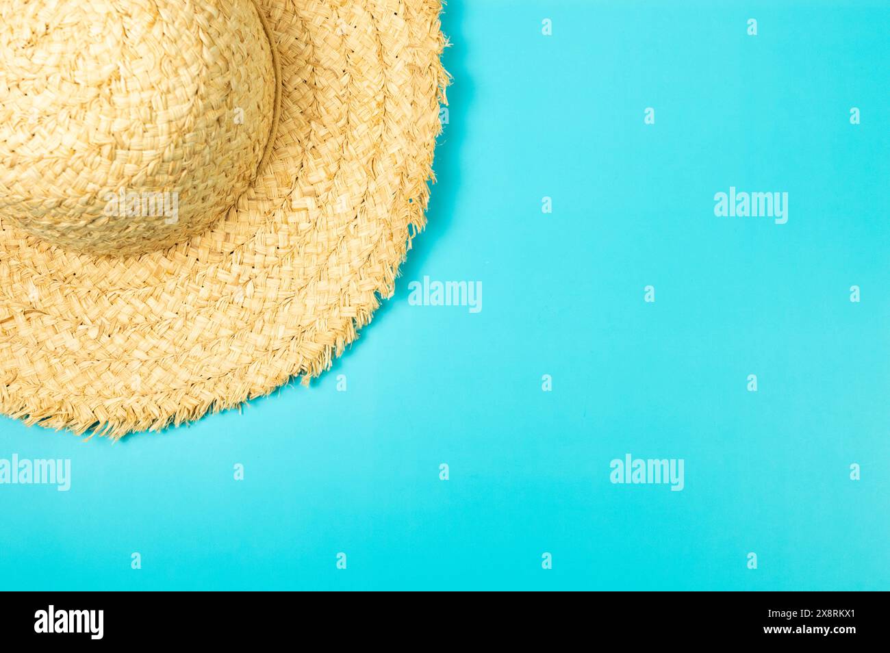Top view of straw hat on blue background. Summer fashion, vacation and ...