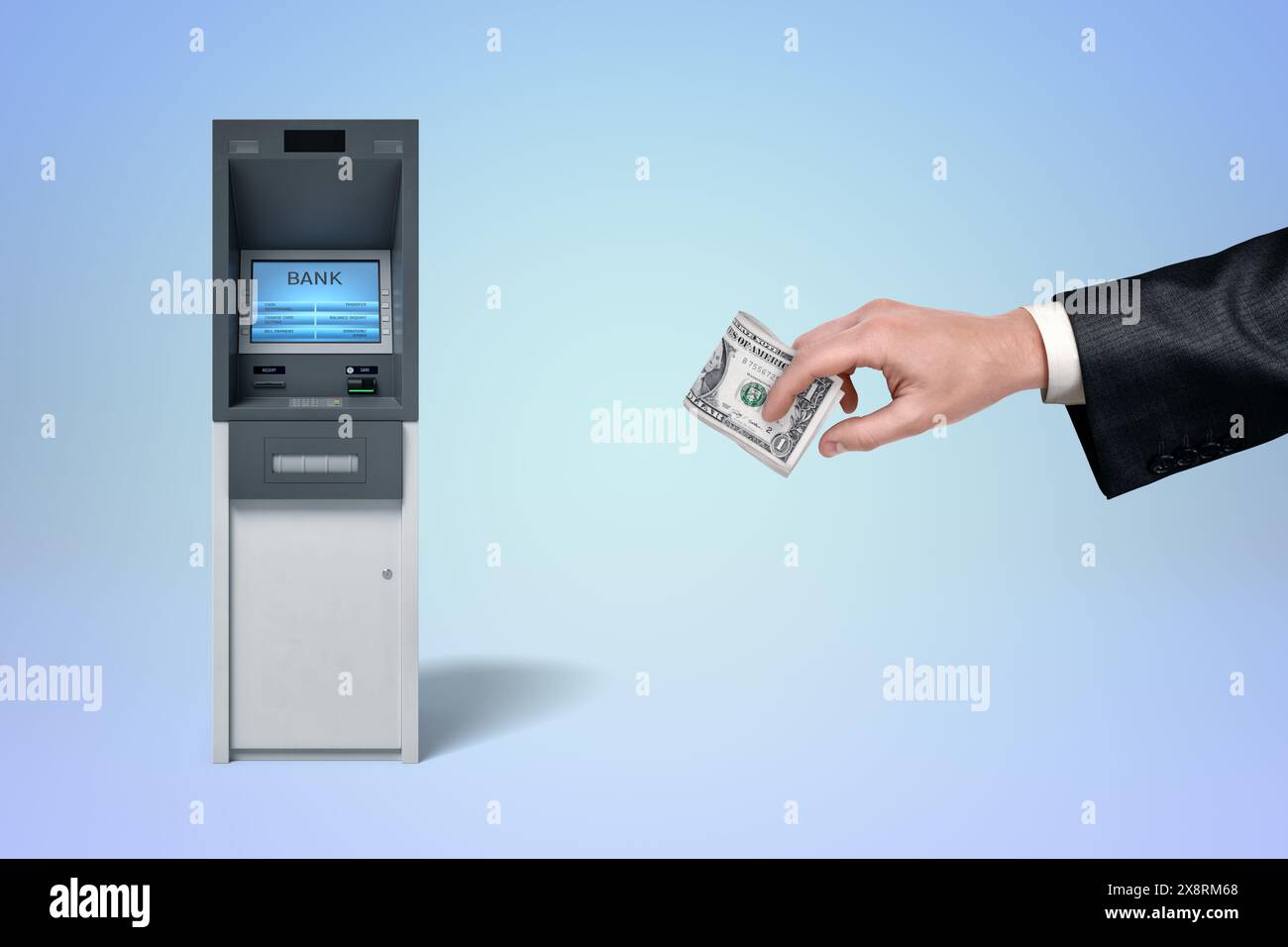 Hand withdrawing cash from ATM machine Stock Photo - Alamy