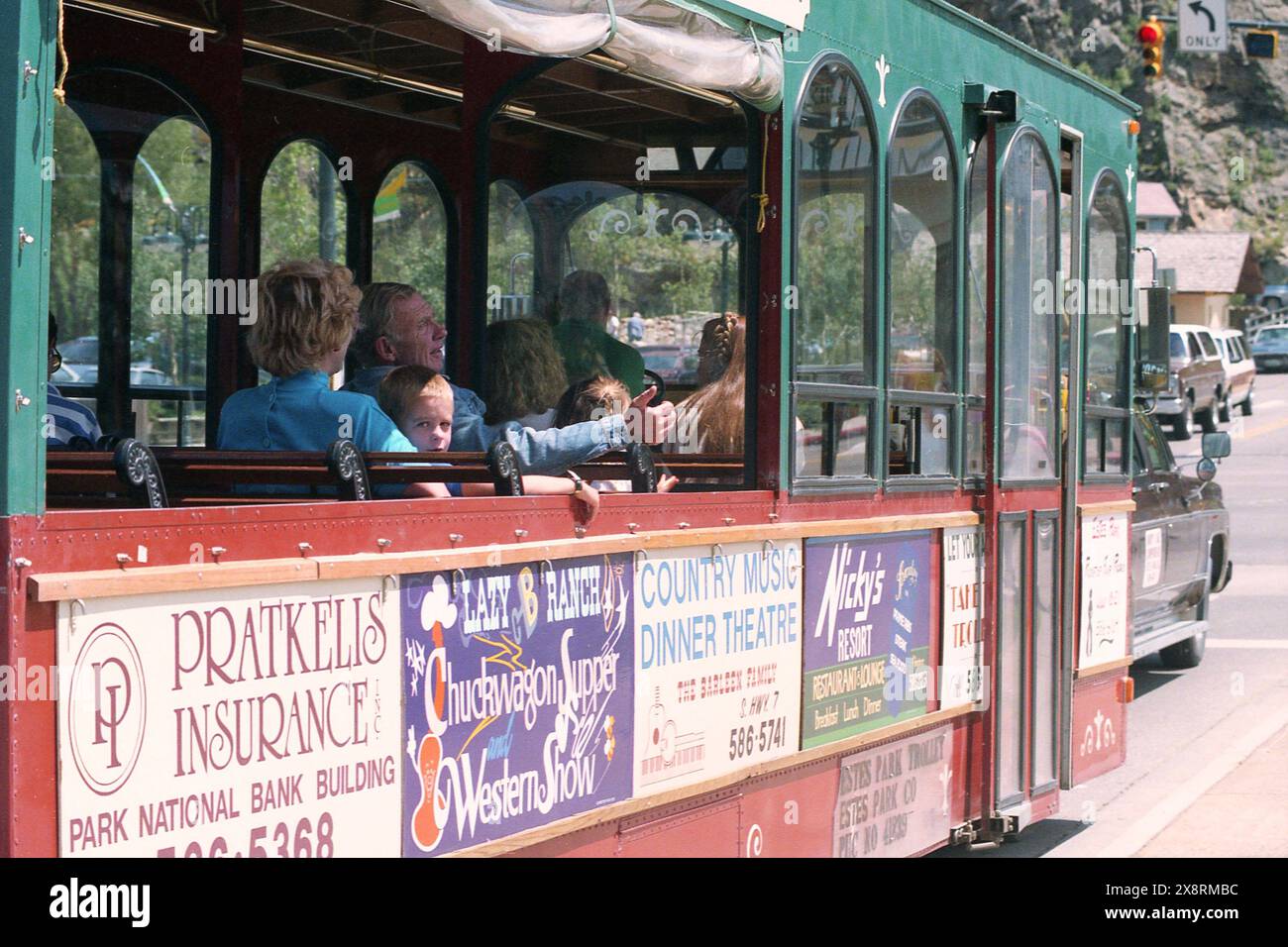 Estes Park, Colorado, U.S.A., approx. 1987. People riding the trolley ...