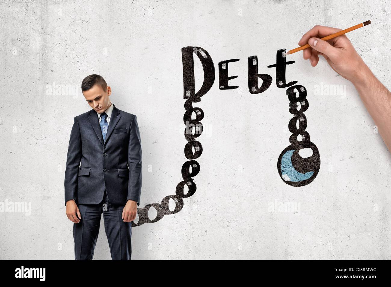 Businessman with debt chain and ball drawing Stock Photo - Alamy