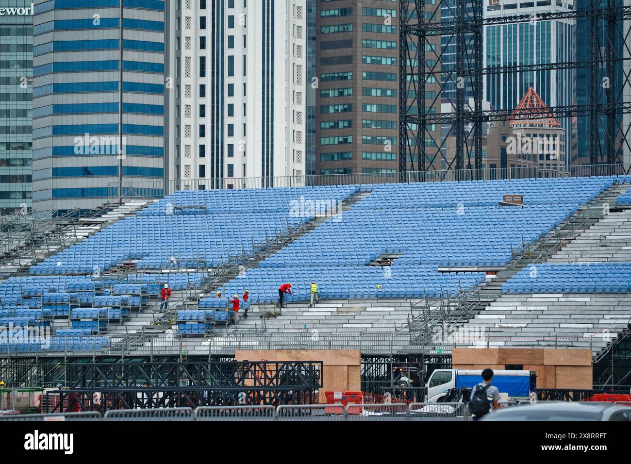 Singapore - 17 May 2024: Workers setting up temporary grandstands at ...