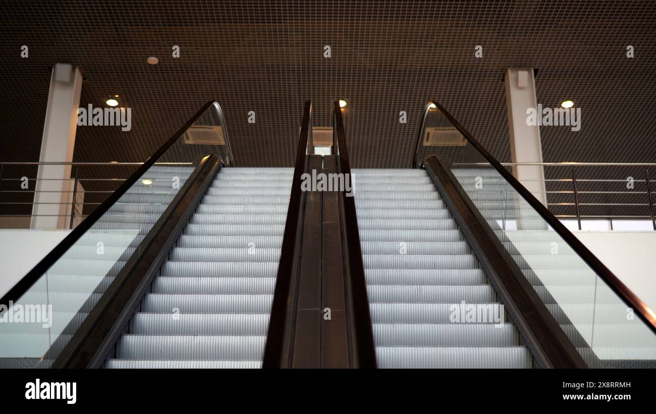 Empty moving staircase running up and down. Media. Modern indoor escalator stairs Stock Photo ...