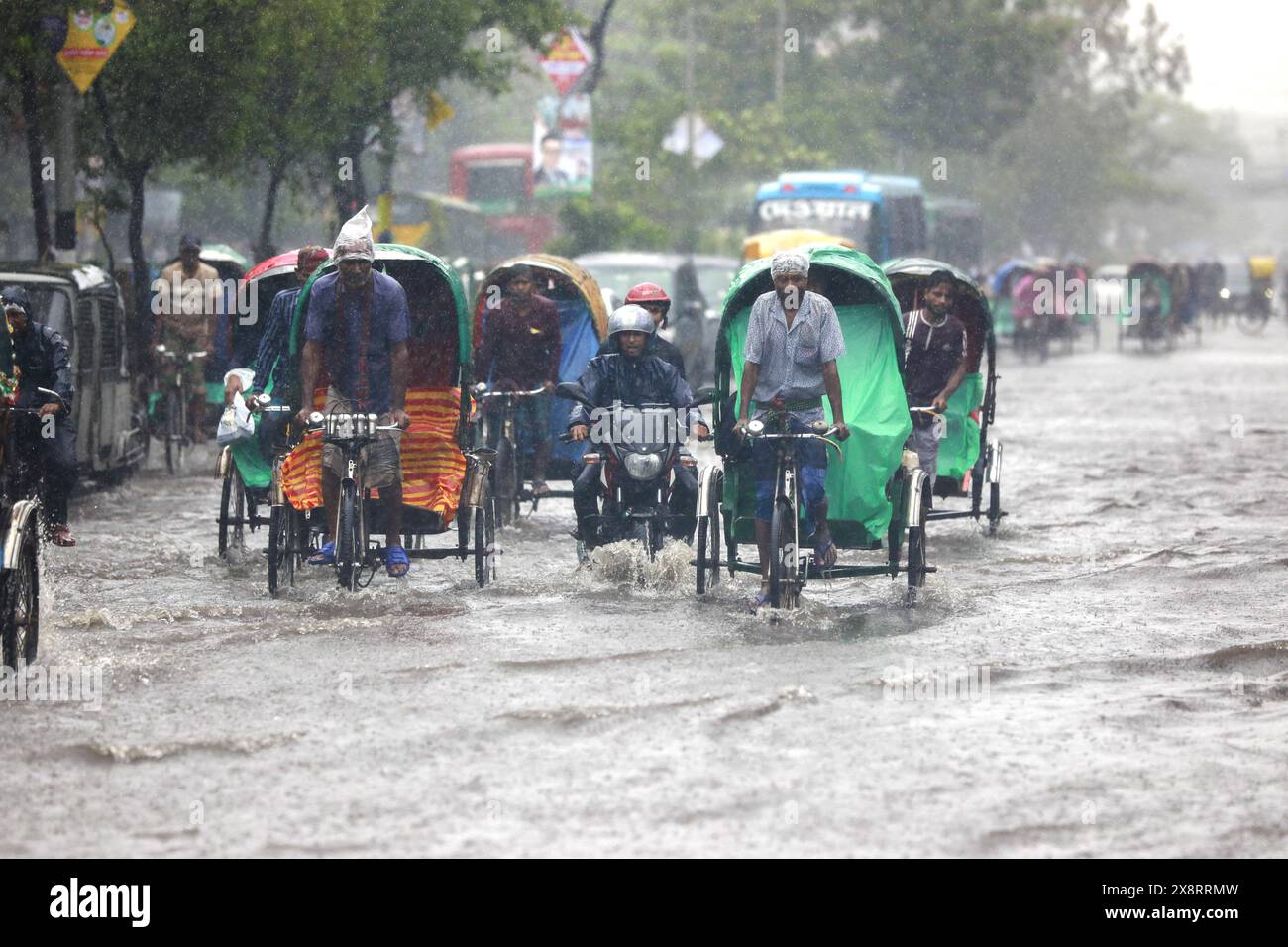Commuters suffer during heavy rain caused by the cyclone 'Remal' in ...