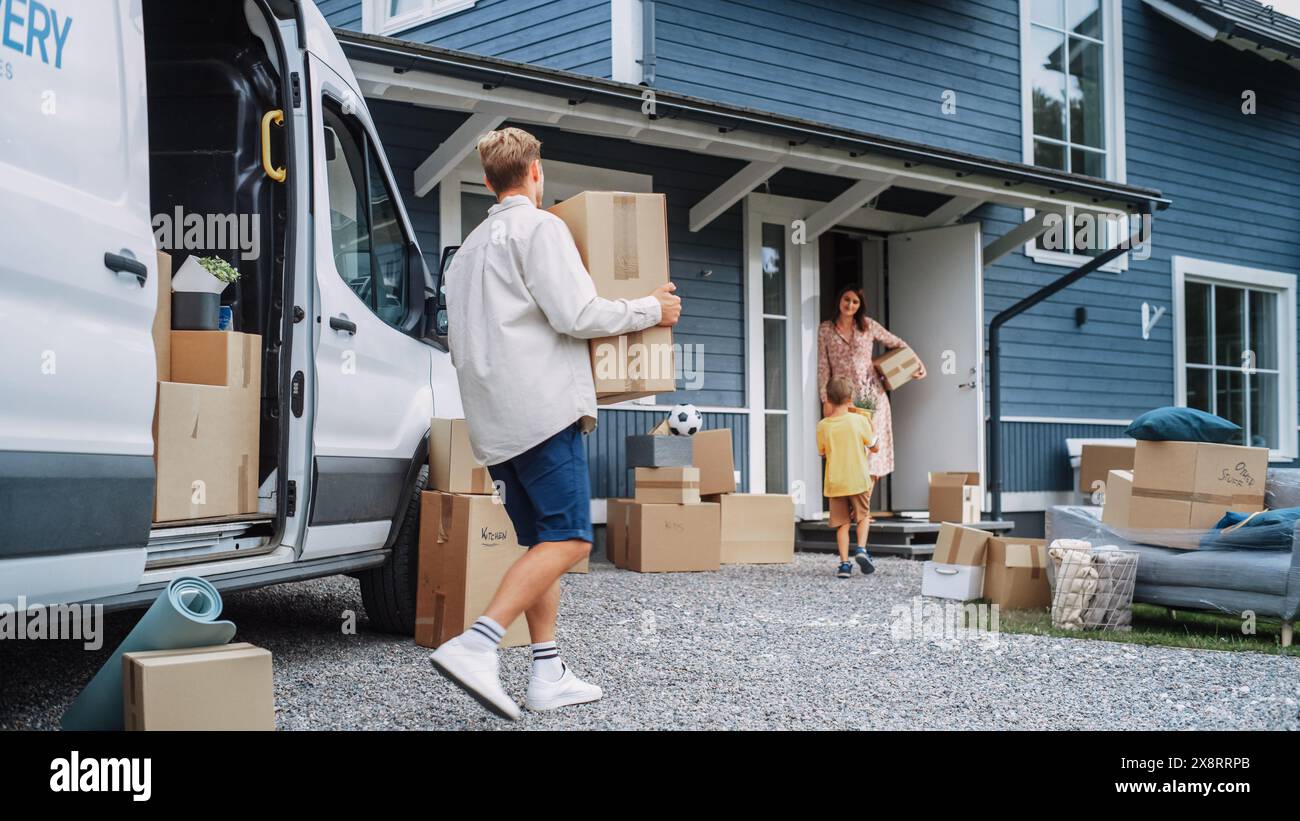 Handsome Man Unloading a Cargo Van Full of Cardboard Moving Boxes ...