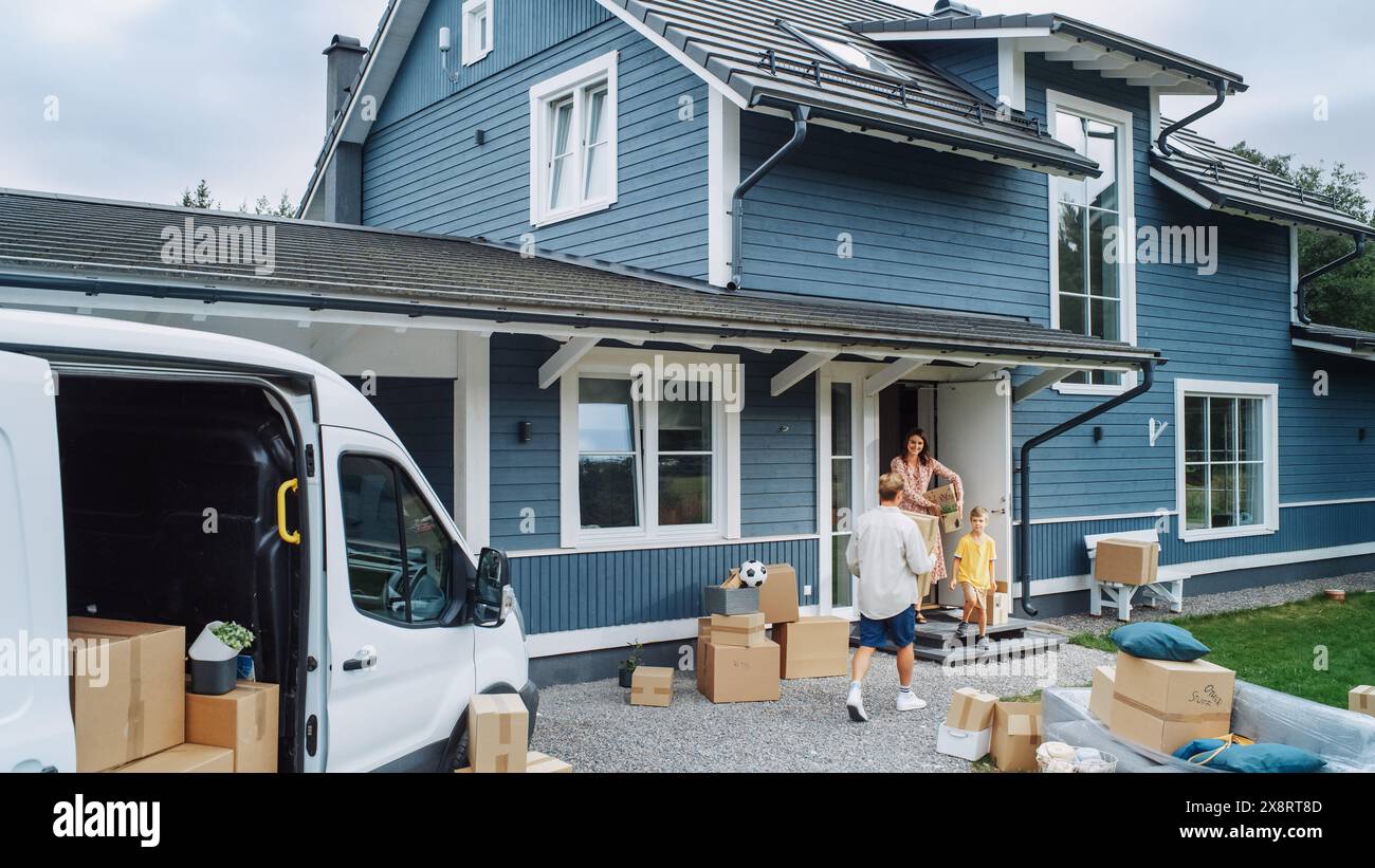 Husband, Wife and a Young Son Moving to Their New Home in Residential ...