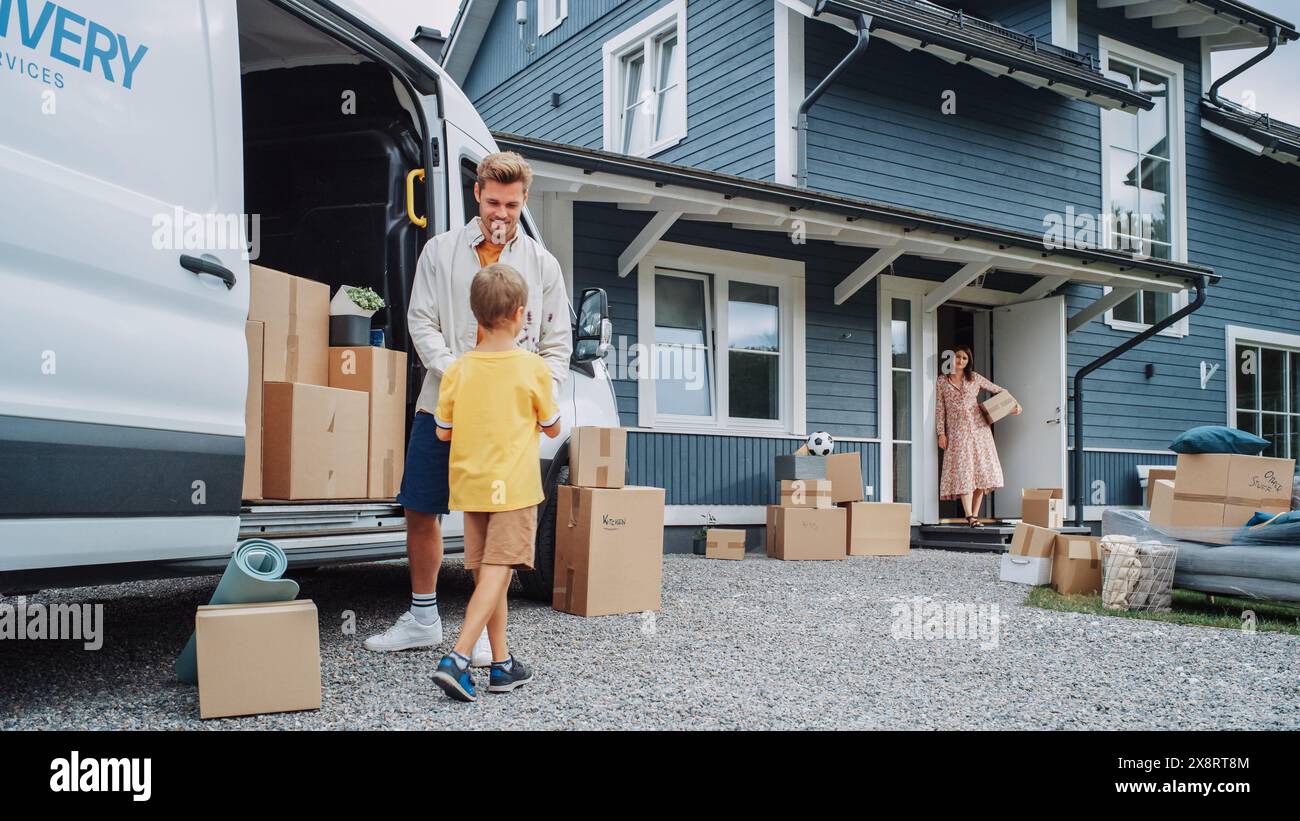 Handsome Man Unloading a Cargo Van Full of Cardboard Moving Boxes ...