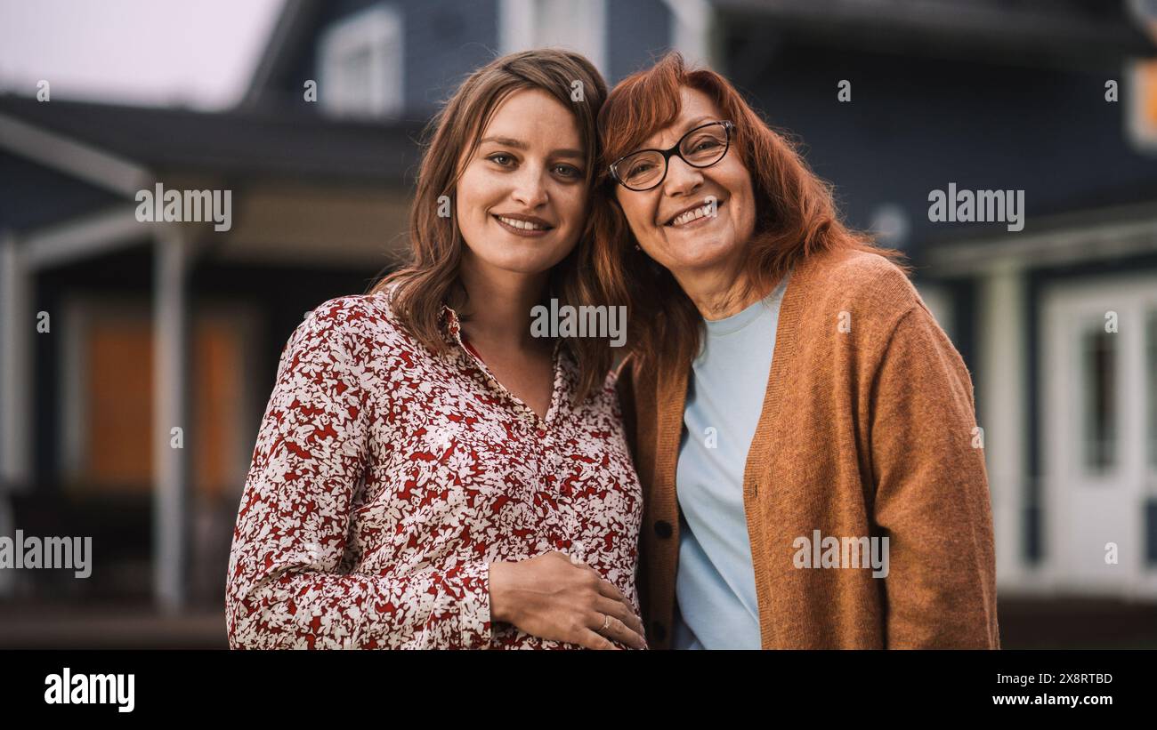 Portrait of a Cheerful Beautiful Female Standing Together with Her ...