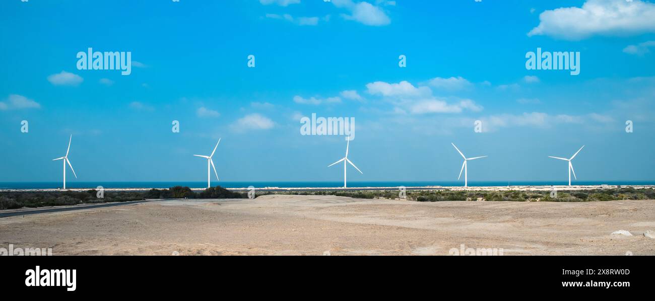 Sir Bani Yas, UAE - January 5, 2024: Wind turbines stand against a ...