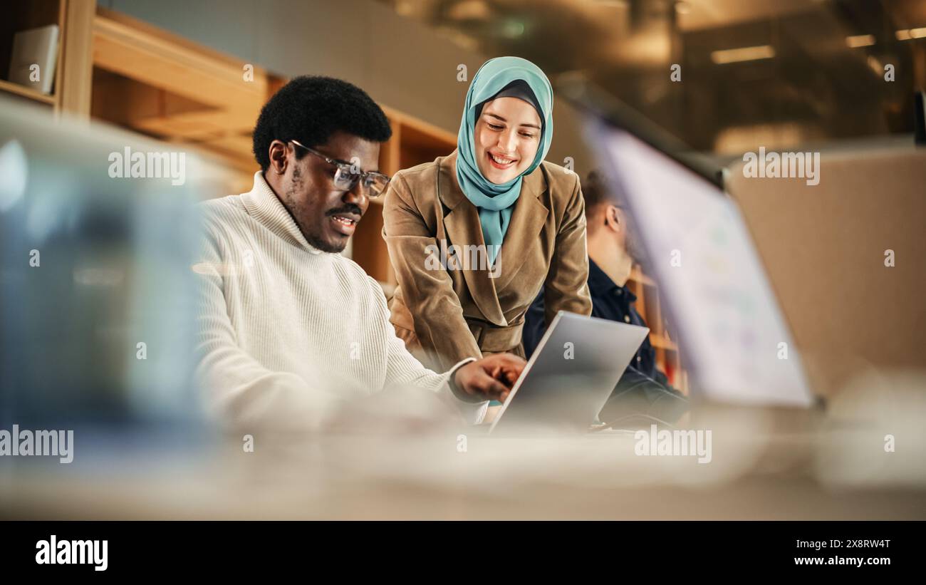 Two Coworkers Talking and Congratulating Eachother with a High Five ...