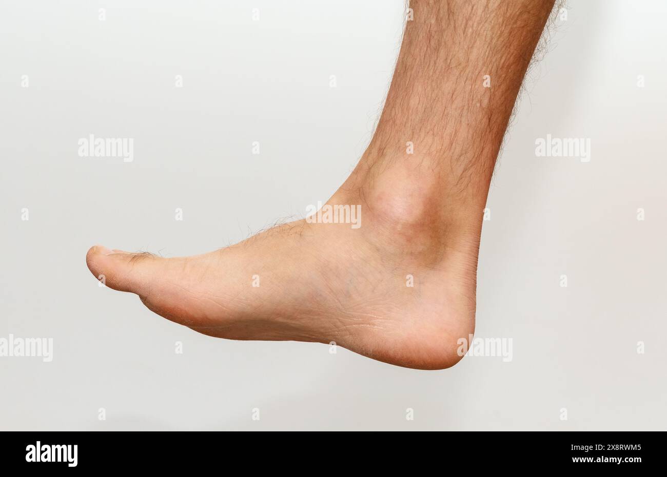 Inner side side of male foot on plain white background. Graphic ...