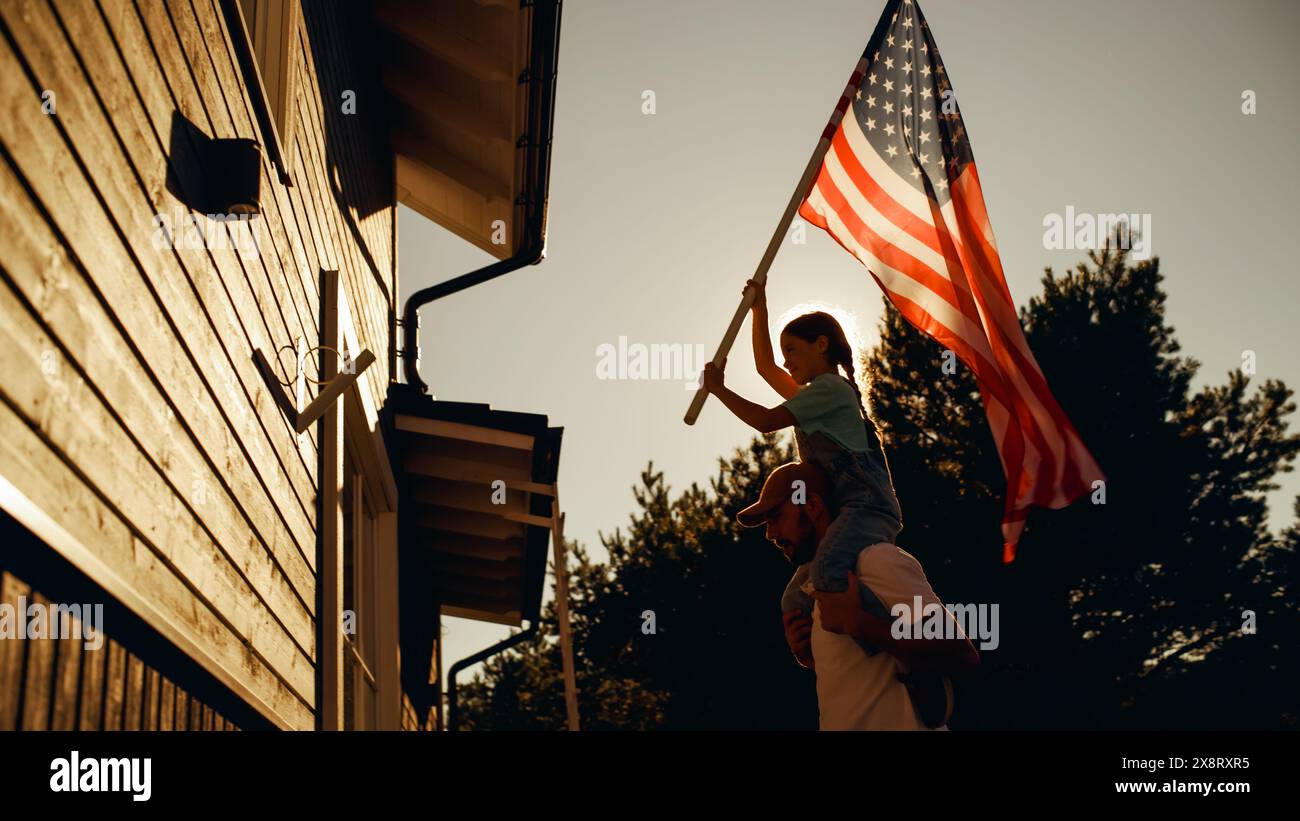 Cinematic Shot of a Father Holding His Small Daughter of His Shoulders ...