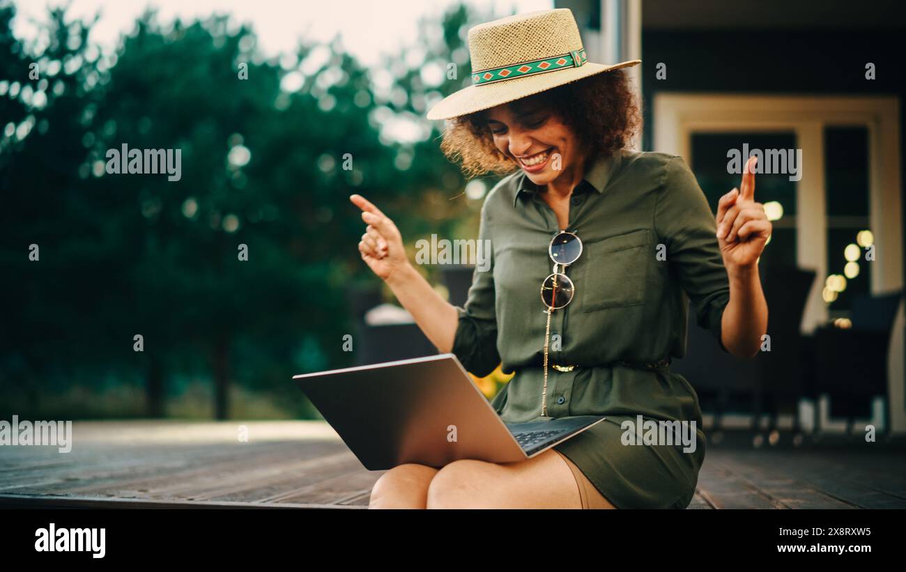 Portrait of a Positive Multiethnic Female Using Laptop Computer on a ...