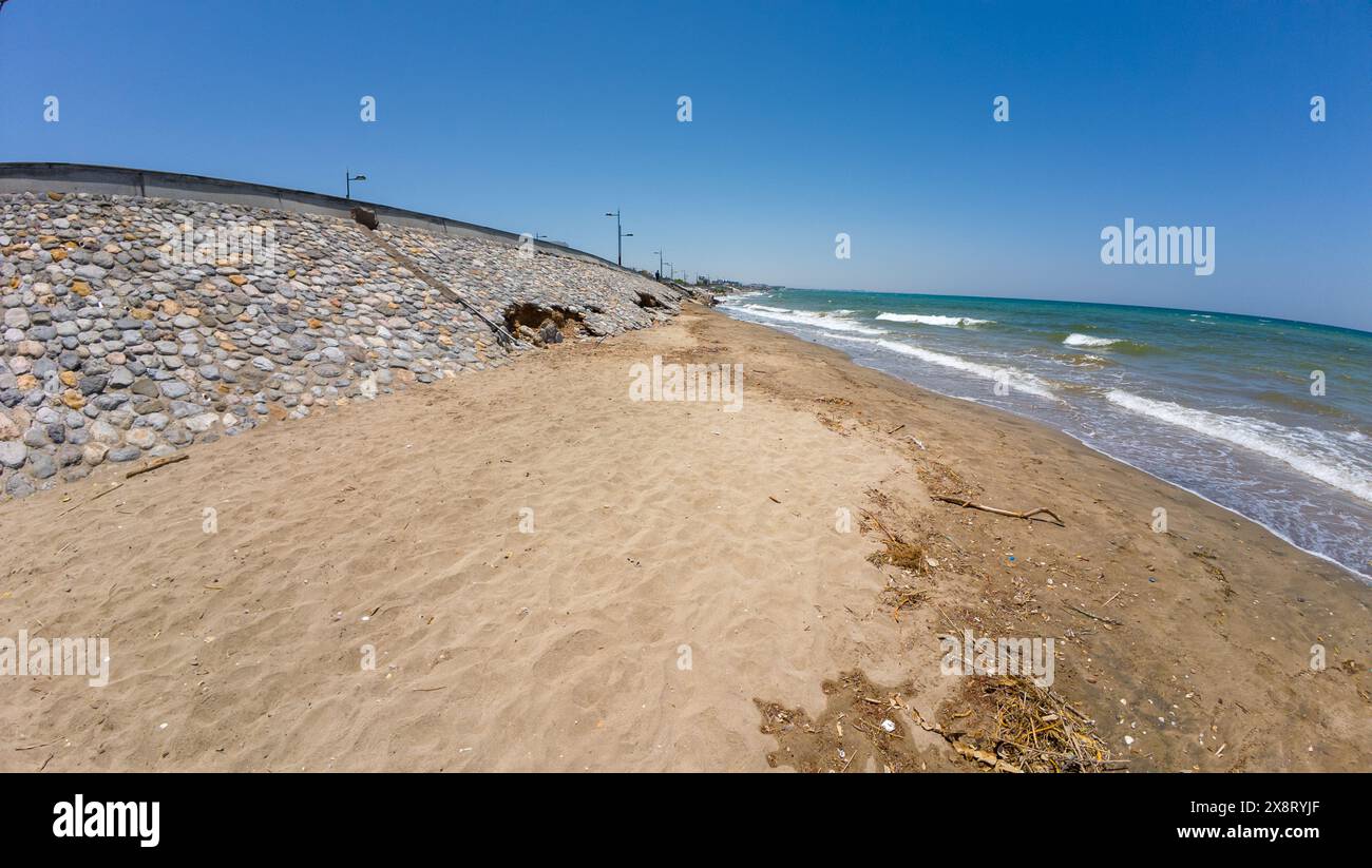 Photography of eroded stone wall near a beach and sea in Oman Muscat ...