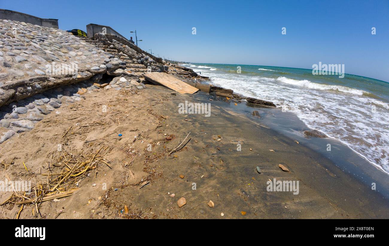 Photography of eroded stone wall near a beach and sea in Oman Muscat ...
