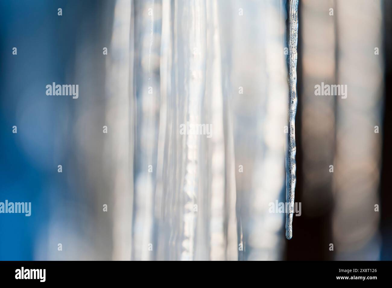 Numerous icicles are hanging from the side of a building in Norway ...