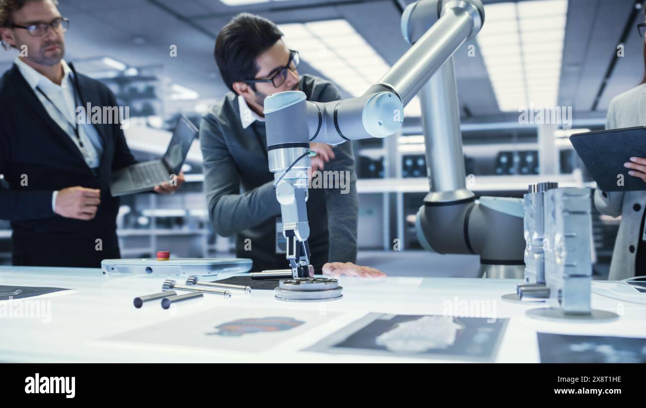 Modern Robotic Arm Holding and Moving a Mechanical Metal Component ...