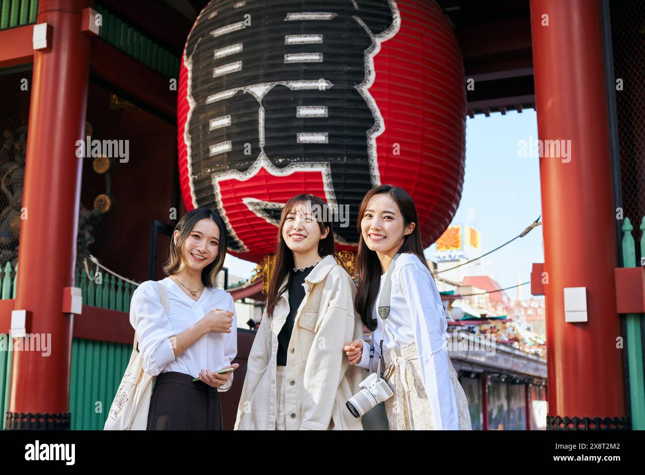 Japanese friends visiting traditional temple in Tokyo Stock Photo - Alamy