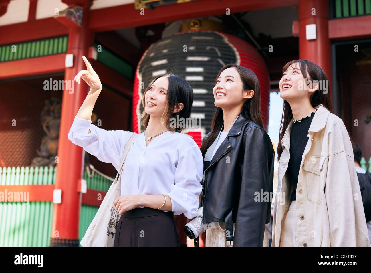 Japanese friends visiting traditional temple in Tokyo Stock Photo - Alamy