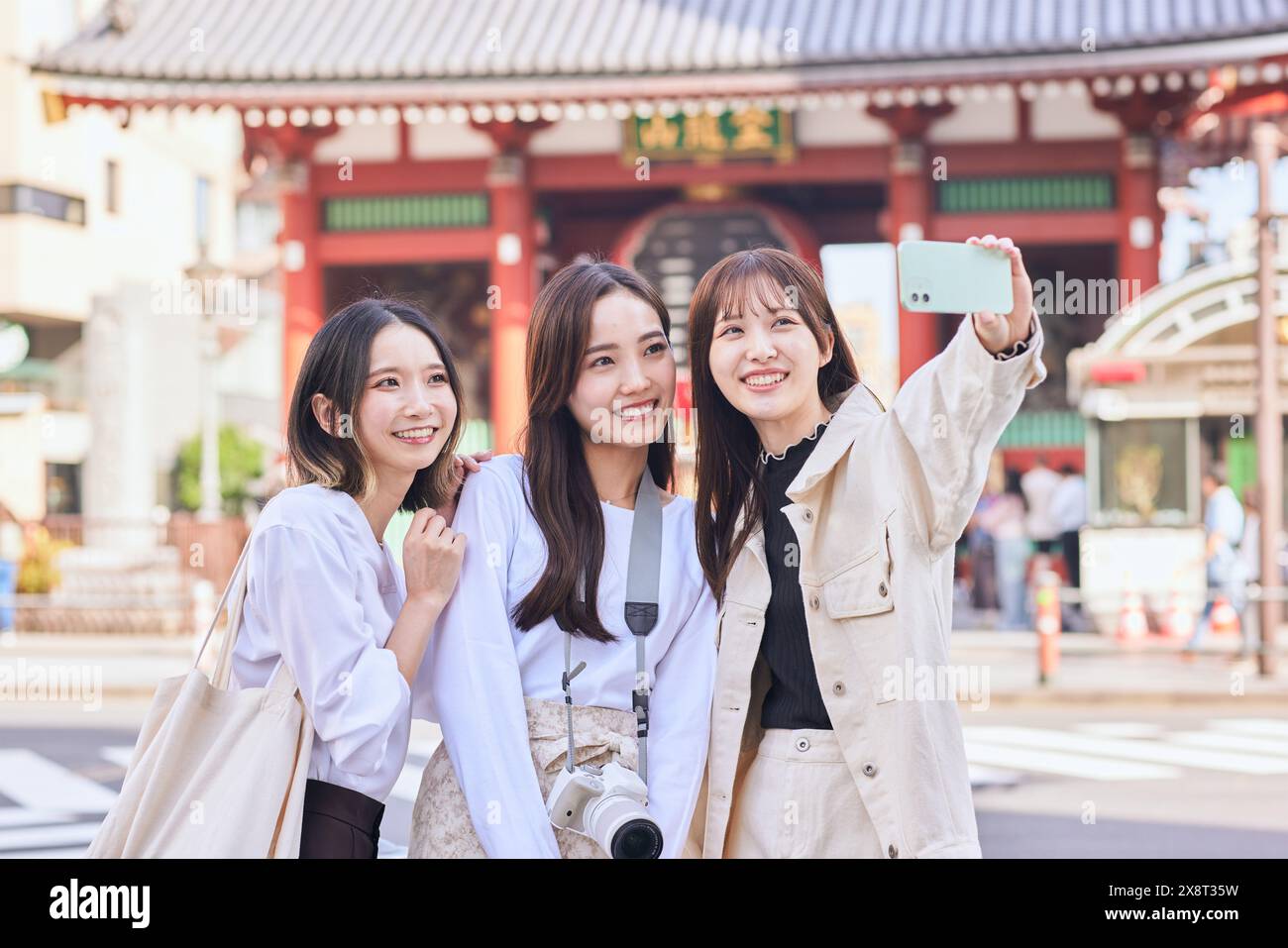 Japanese friends visiting traditional temple in Tokyo Stock Photo - Alamy