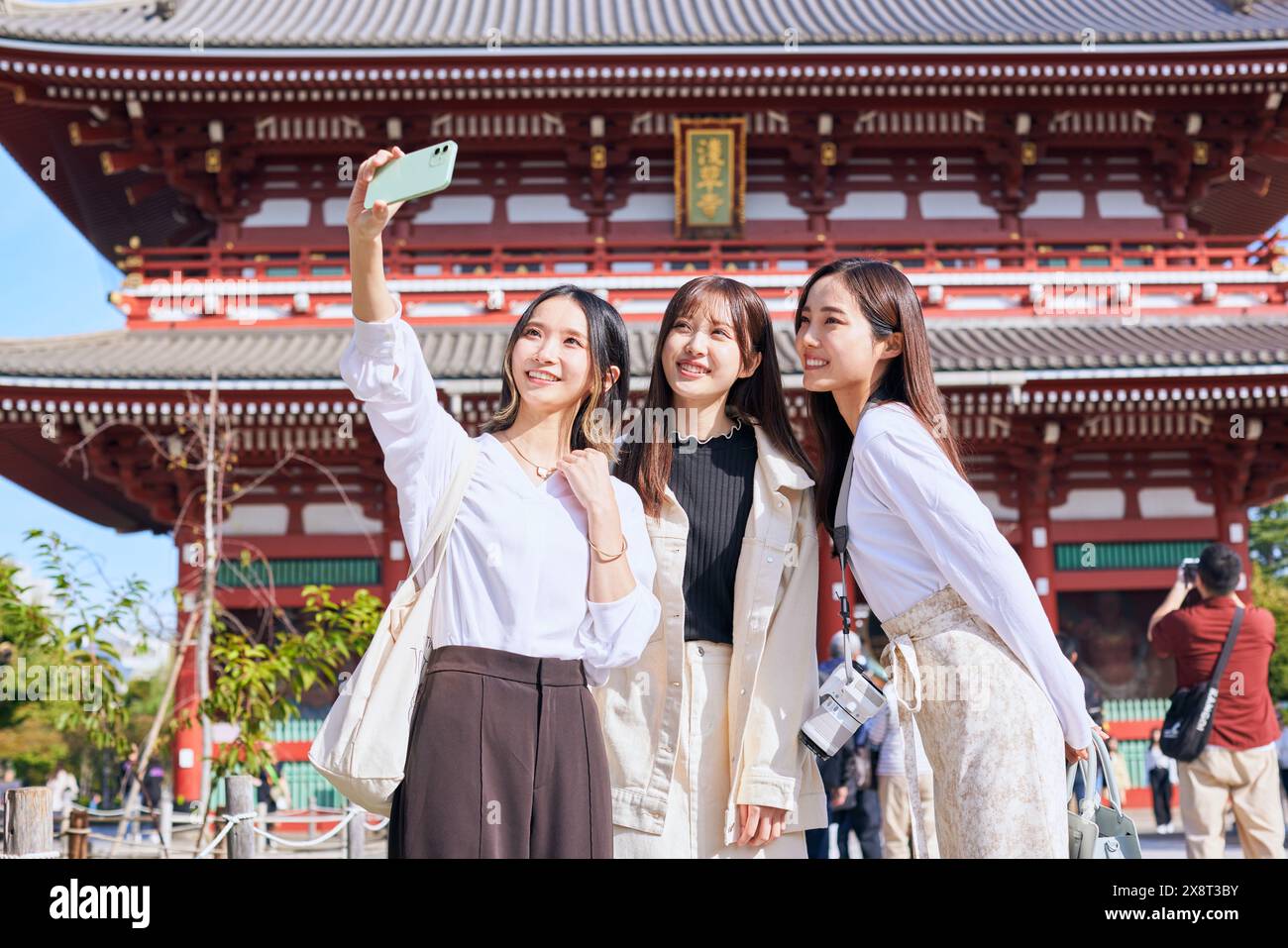 Japanese friends visiting traditional temple in Tokyo Stock Photo - Alamy