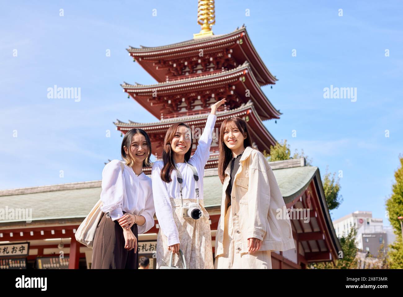 Japanese friends visiting traditional temple in Tokyo Stock Photo - Alamy