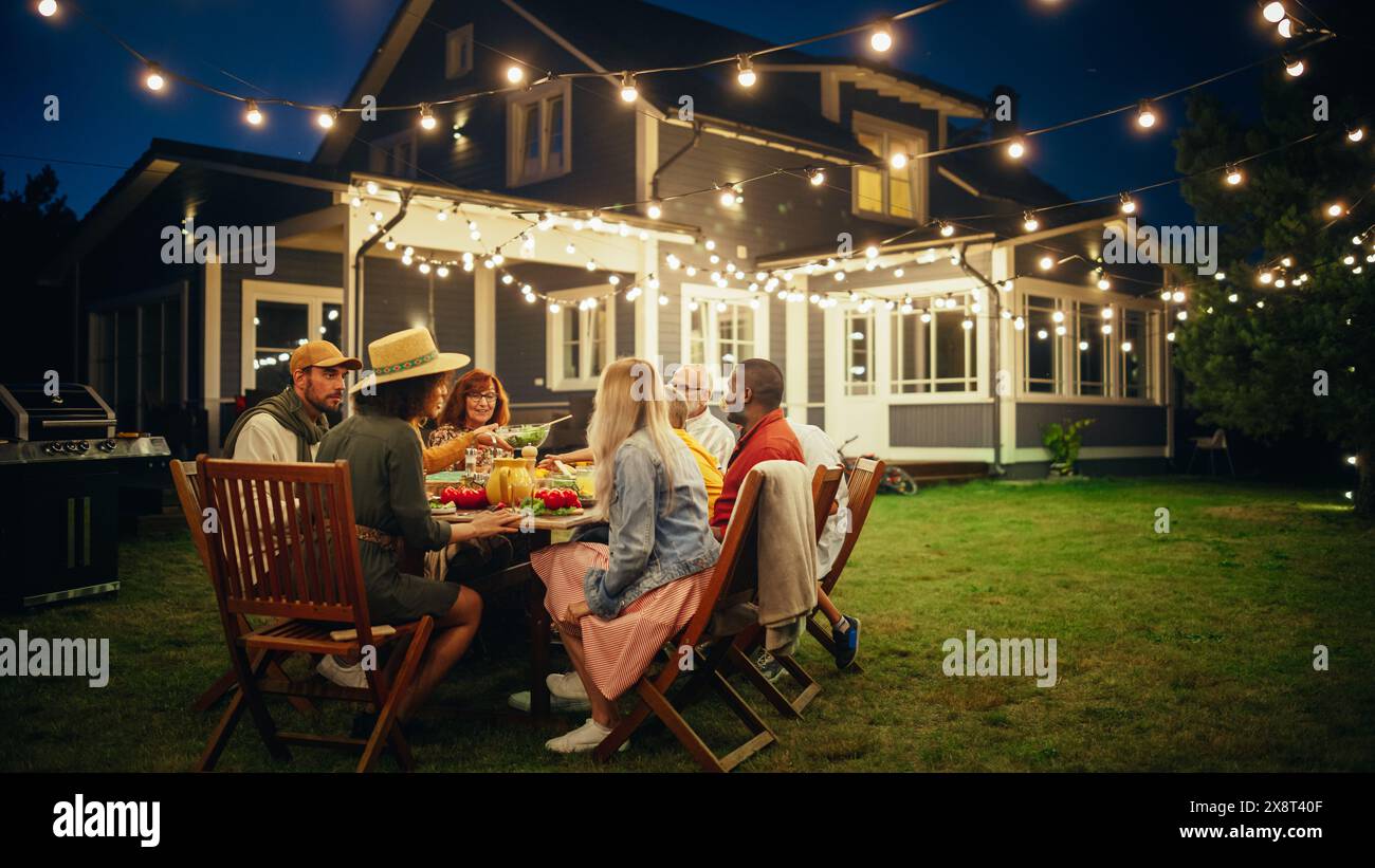 Big Family Garden Night Party Celebration, Gathered Together at a Table ...