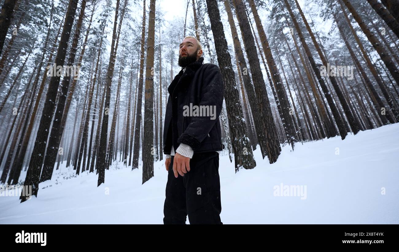 Caucasian man lost in winter forest. Media. Desperate young hipster man ...