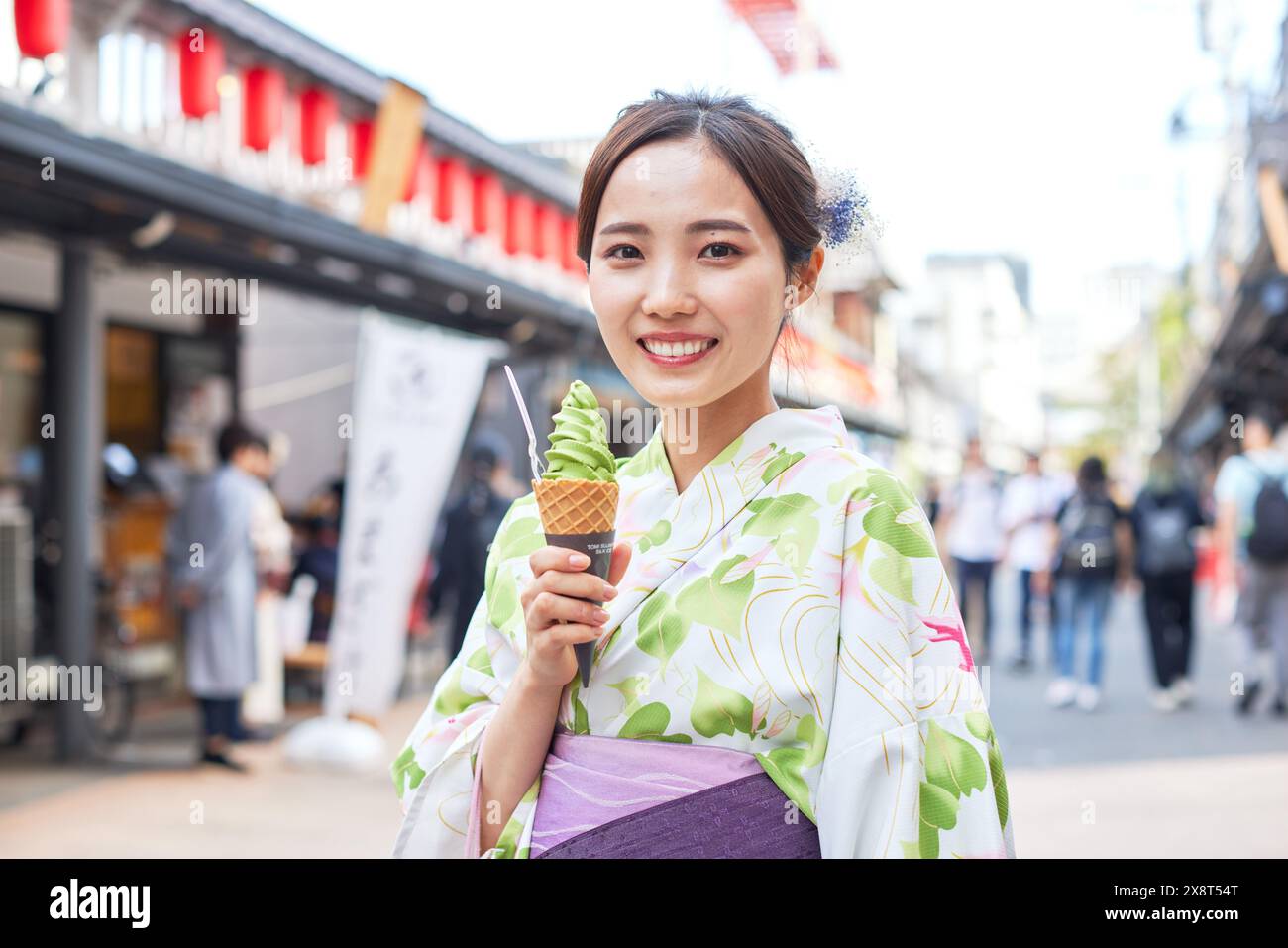 Japanese friends wearing yukata visiting traditional area in Tokyo ...