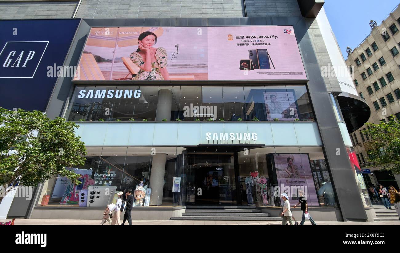 SHANGHAI, CHINA - MAY 27, 2024 - Pedestrians walk past the flagship ...