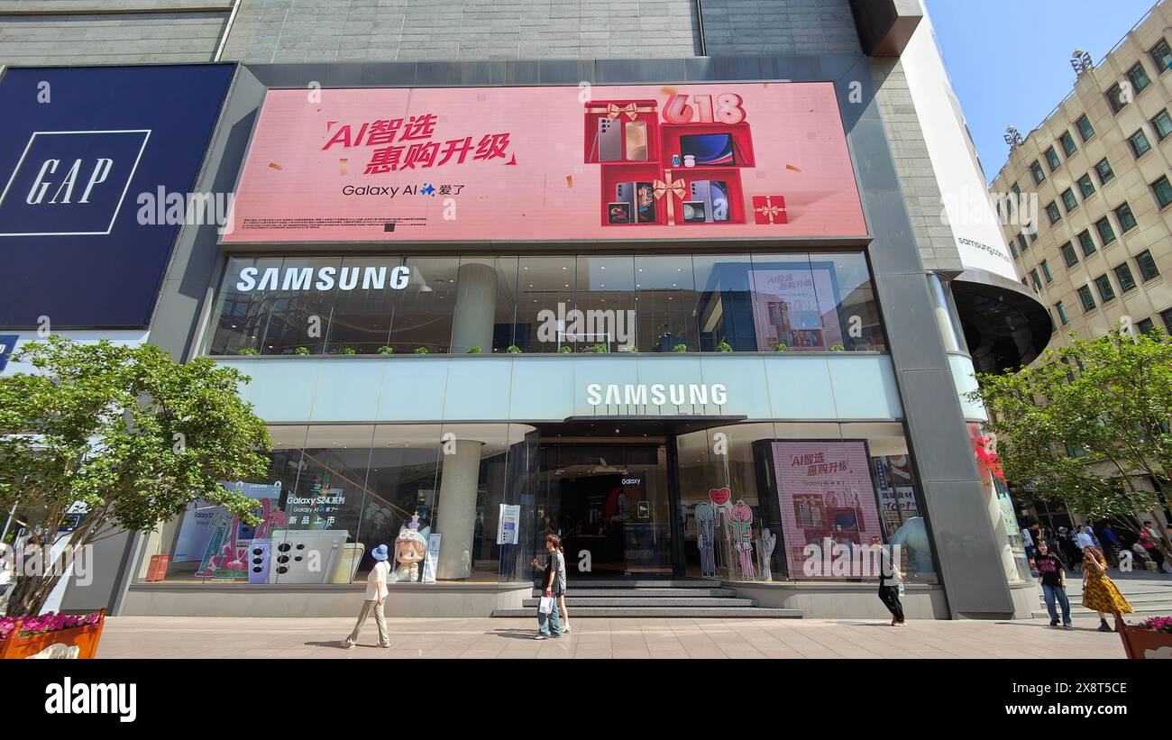 SHANGHAI, CHINA - MAY 27, 2024 - Pedestrians walk past the flagship ...