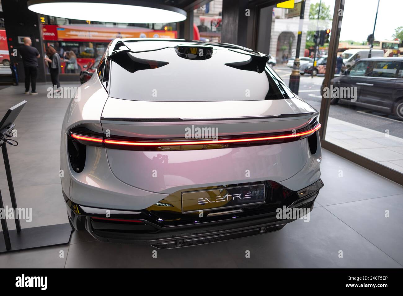 rear view silver battery-Electric Hyper-SUV Lotus Eletre in showroom ...