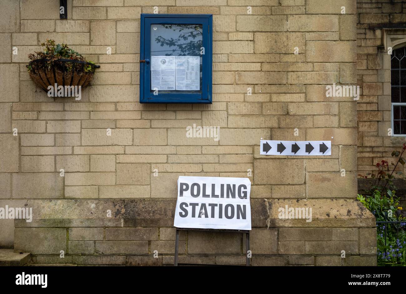 Signs outside a Catholic church pointing to an election polling station ...