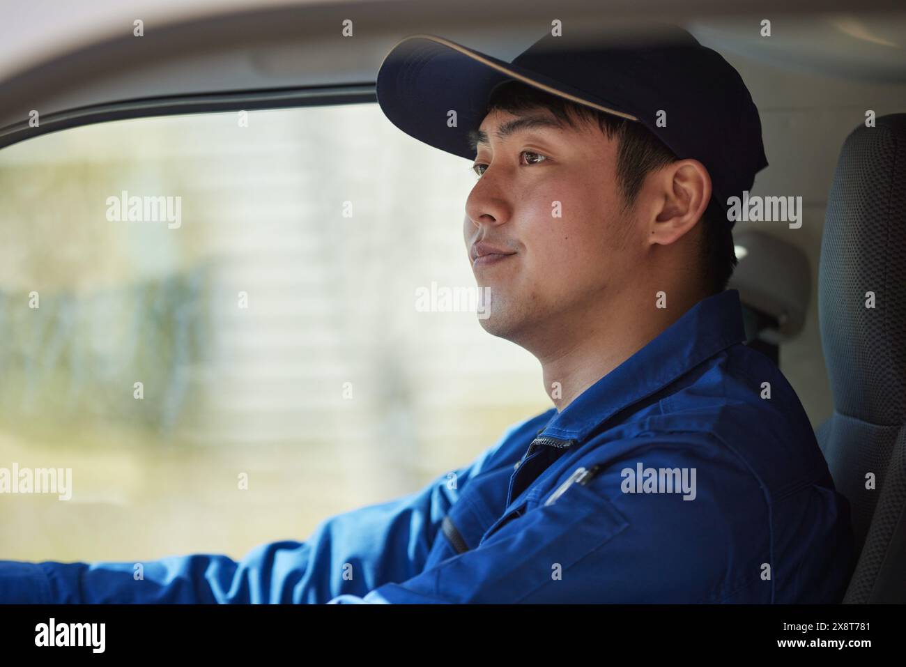 Japanese delivery man driving a car Stock Photo - Alamy
